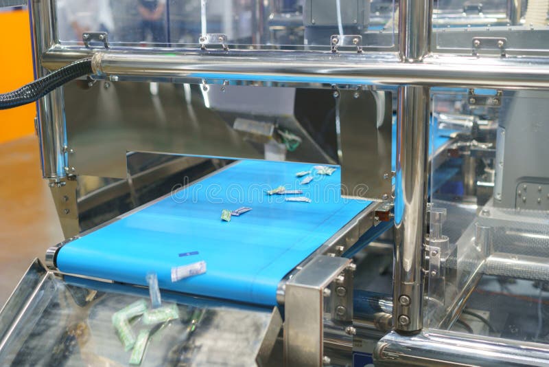 High-Speed Conveyor System for Product Packaging Stock Photo - Image of ...