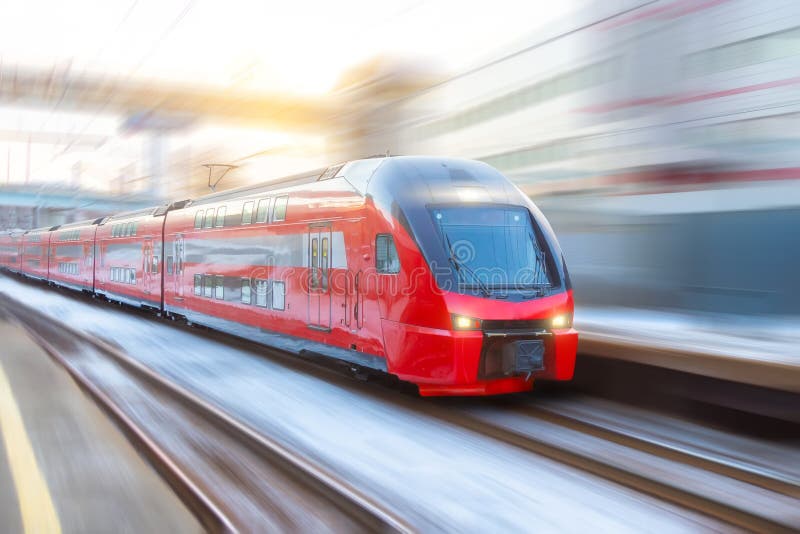 High Speed Double Decker Express Train Arrives at a Station in the City ...