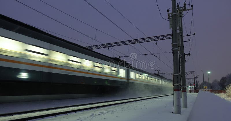 High-speed Passenger Electric Train at Night. a Beam of Train Spotlight ...
