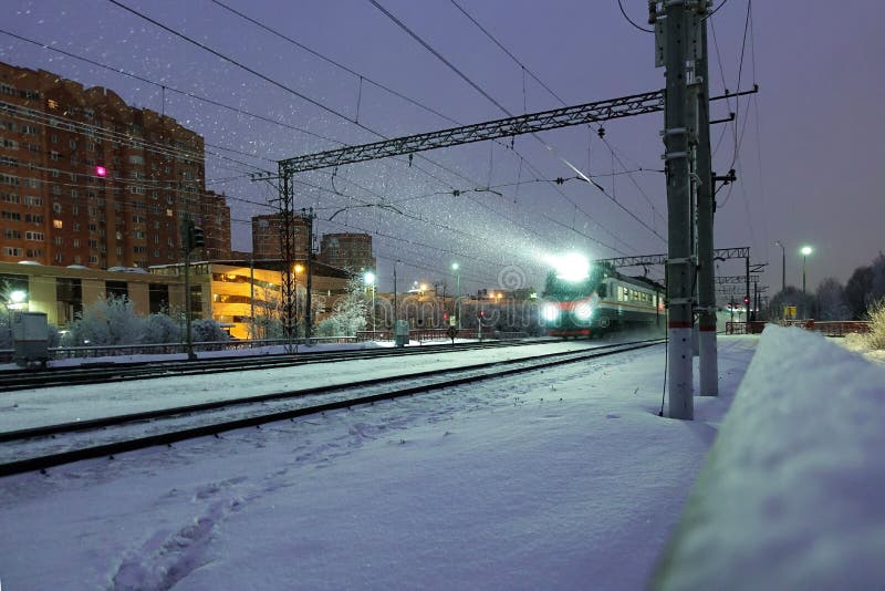 High-speed Passenger Electric Train at Night. a Beam of Train Spotlight ...