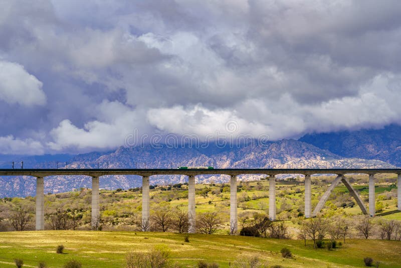 High Speed Train Ave, Passing Over a Large Viaduct Over the Green ...