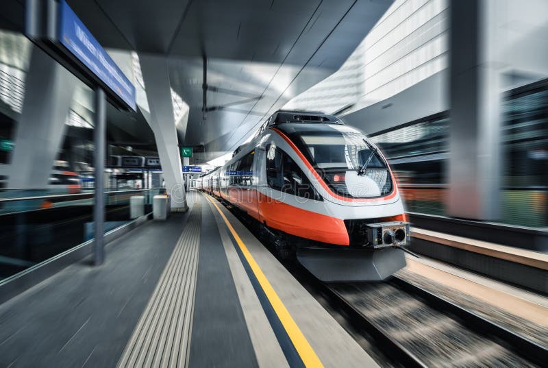 High Speed Train in Motion on the Railway Station at Sunset Stock Photo ...
