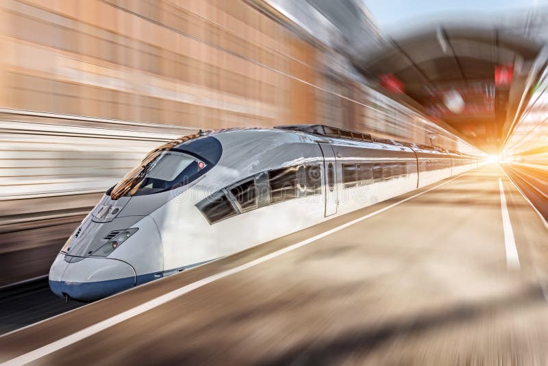 High Speed Train Passing Near the Passenger Station Stock Photo - Image ...