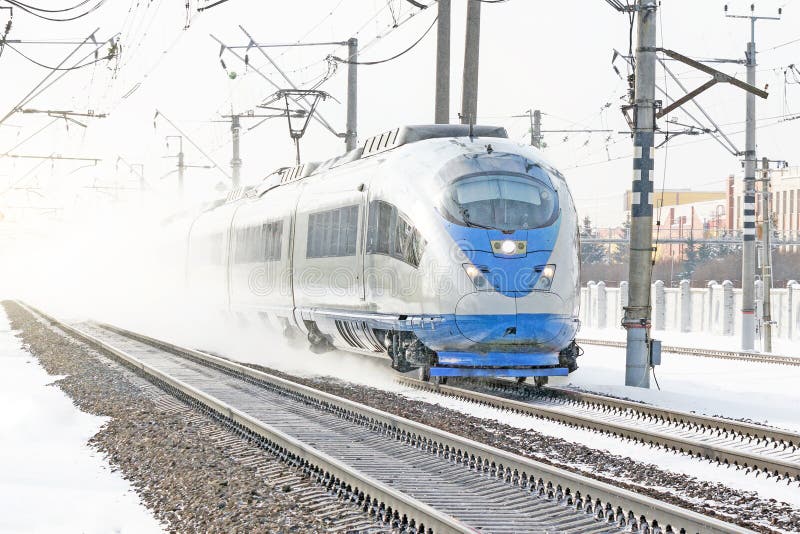 High-speed Train Rides at High Speed in Winter Around the Snowy ...