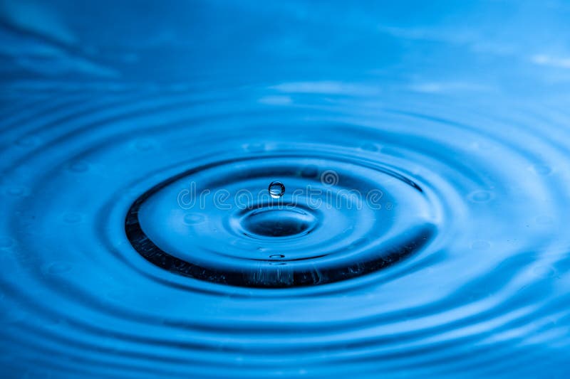 High Speed Water Drop Photography. Blue With Single Drop About To ...