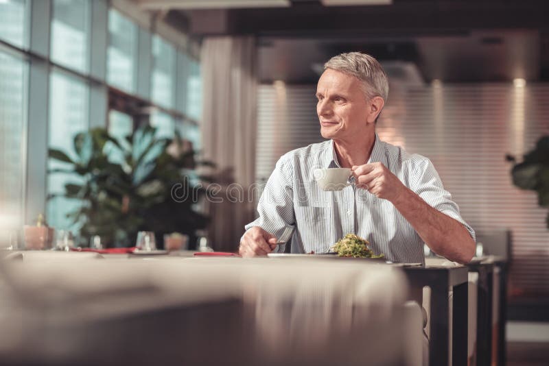 High-spirited Old Man Drinking Tea in a Restaurant Stock Photo - Image ...