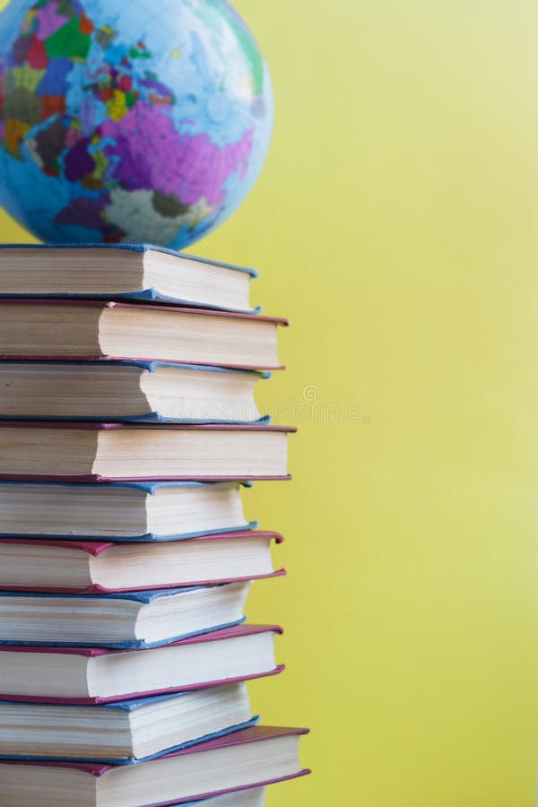 High Stack of Books with Globe and Copy Space. Stock Photo - Image of ...