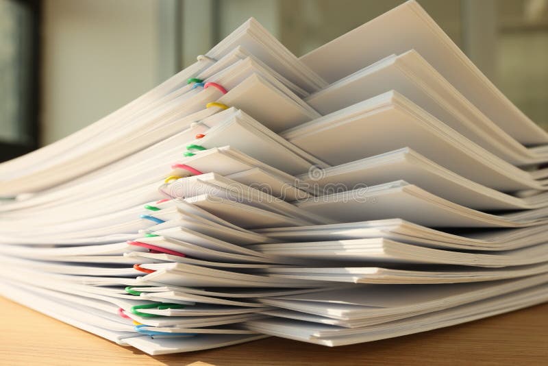 High Stack of Office Documents with Clips on Office Table Close Up ...