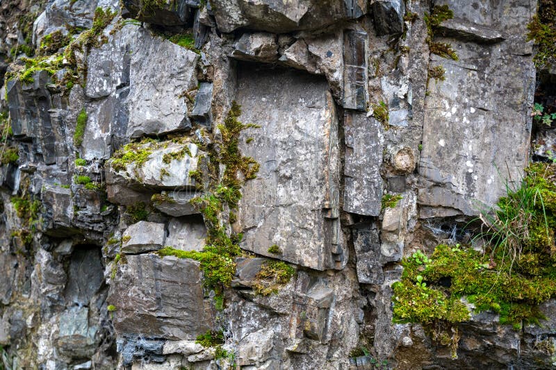 High stone wall with moss stock photo. Image of stone - 276762148