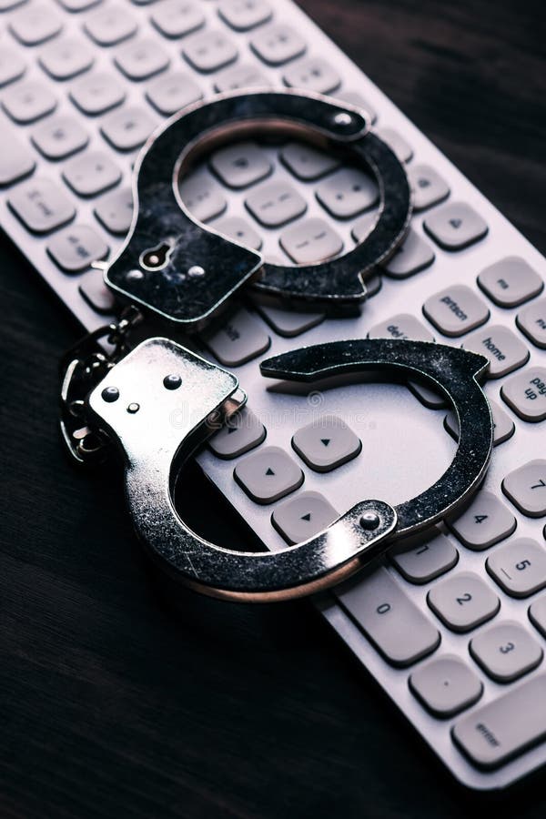 High Tech it Cyber Crime Arrest Concept, Image of Police Handcuffs Over ...
