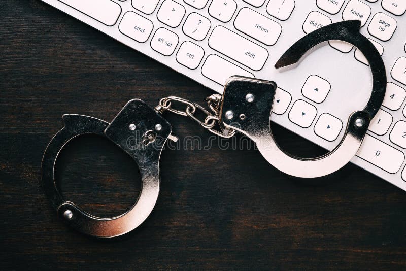 High Tech it Cyber Crime Arrest Concept, Image of Police Handcuffs Over ...