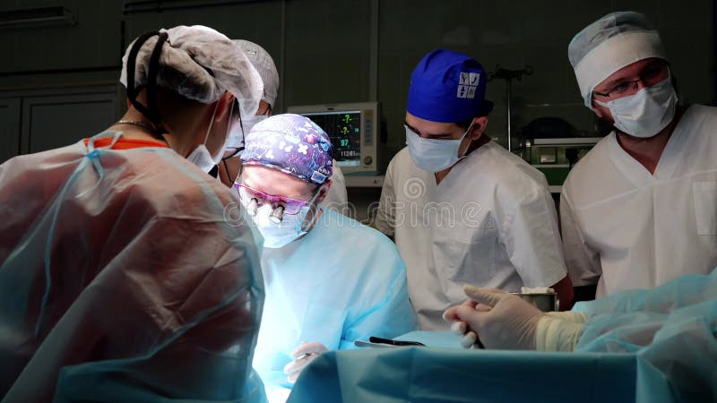 High-tech Hospital Dedicated Group of Surgeons and Assistants Carry Out ...