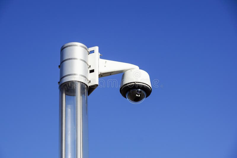 High Tech Overhead Security Camera with a Blue Sky Stock Photo - Image ...