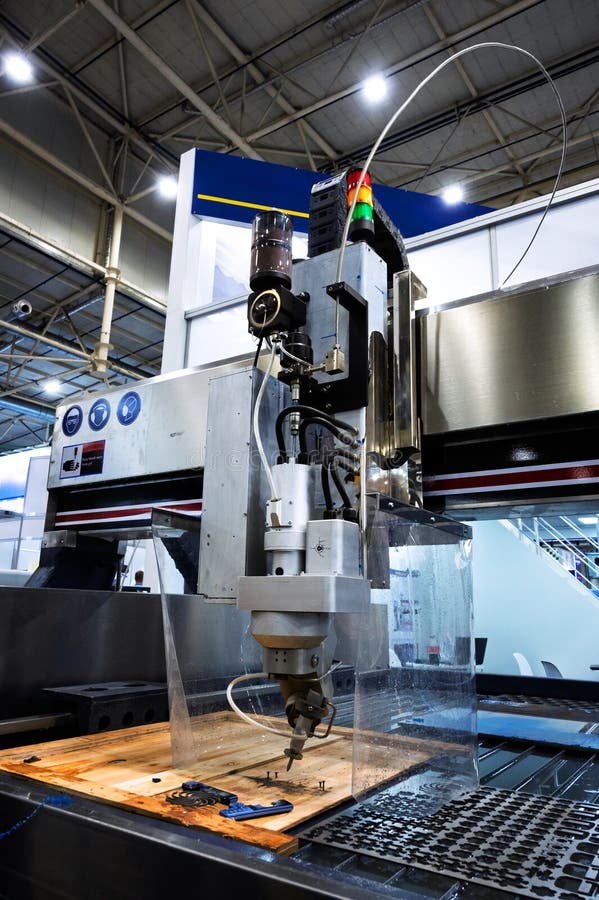 High-tech Waterjet Cutting Machine Head Processing Material on a ...