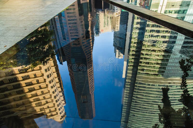 High Tower Buildings Reflection in Blue Pool View Stock Photo - Image ...