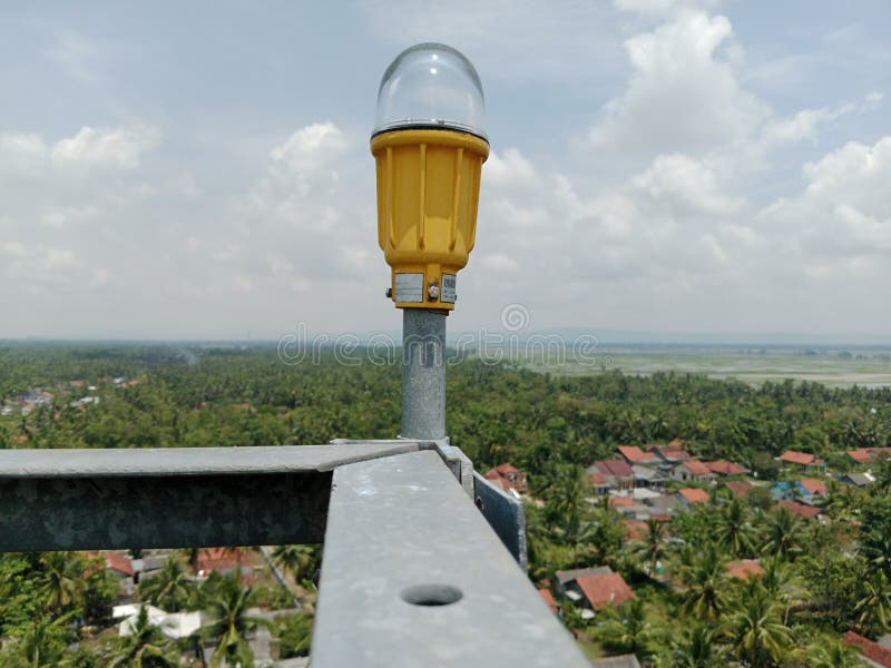 The High Tower Light Comes on at Night in Red Stock Photo - Image of ...