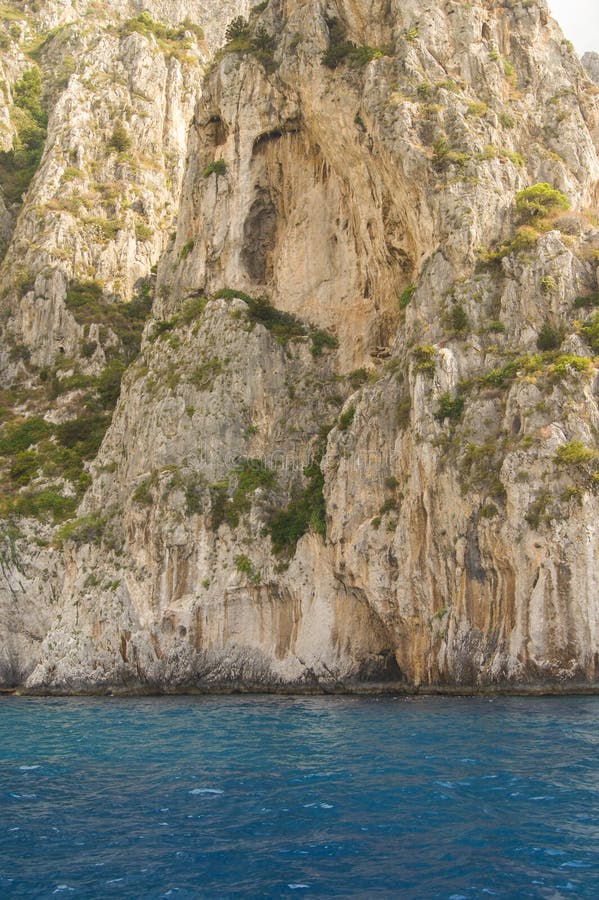 High vertical cliff stock photo. Image of geology, reflection - 53339734