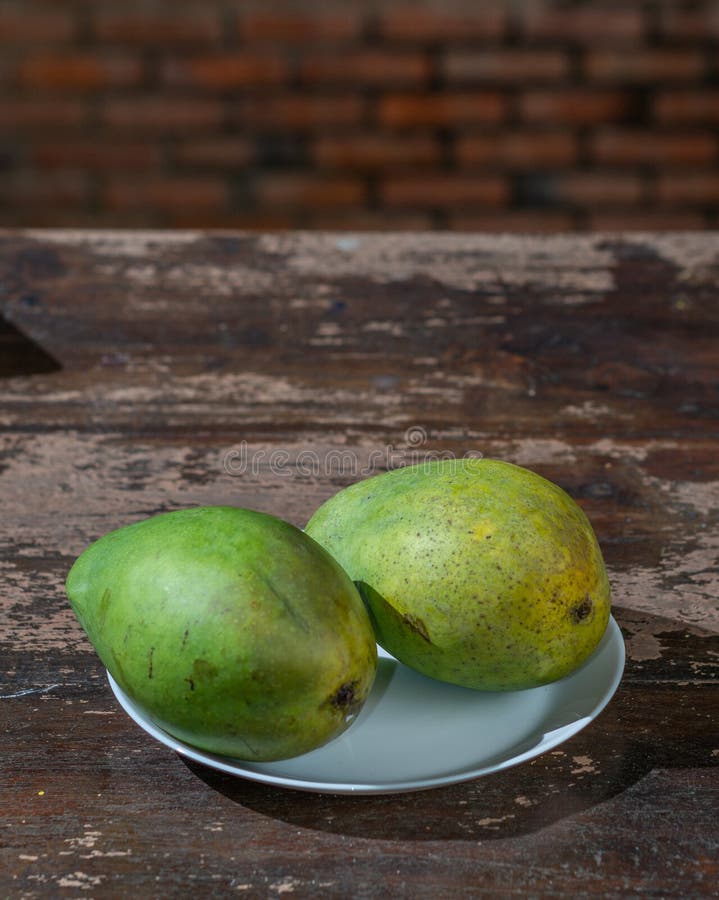 The two mangos stock photo. Image of green, glass, citrus - 307499936