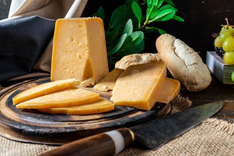 High View of a Piece of Provolone Cheese Cut on a Board Stock Image ...