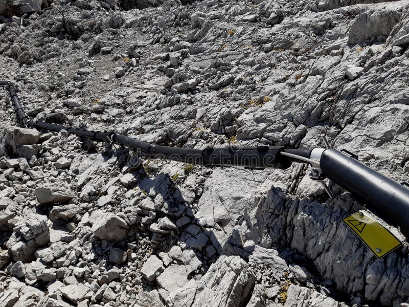 The High Voltage Cable is Attached To the Limestone Rock Using Stock ...
