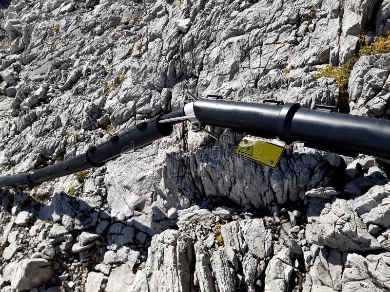 The High Voltage Cable is Attached To the Limestone Rock Using Stock ...