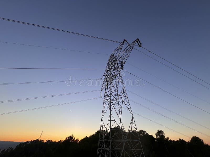 High Voltage Cable Tower during Sunset Stock Photo - Image of ...