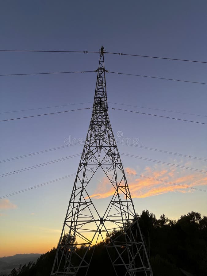 High Voltage Cable Tower during Sunset on a Mountain Stock Image ...