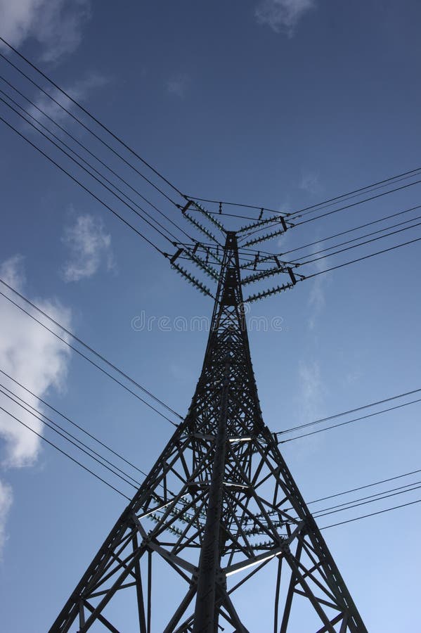 High-voltage Electric Cable Support Towering Towards the Blue Sky Stock ...