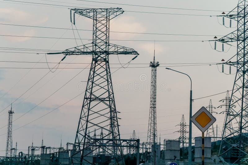 High Voltage Electric Distribution Network at Sunset. Power ...