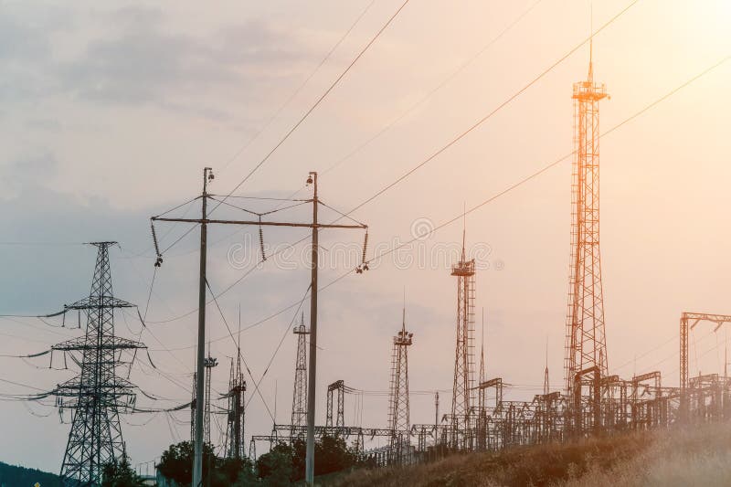 High Voltage Electric Distribution Network at Sunset. Power ...