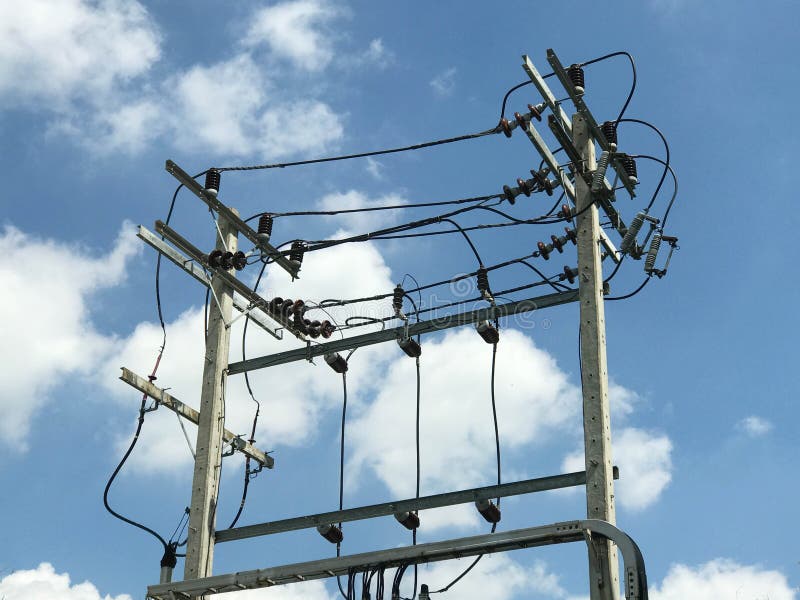 High Voltage Electric Pole Substation Against Blue Sky Stock Photo ...