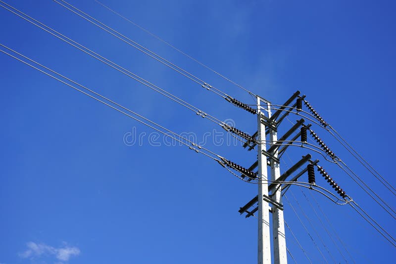 High Voltage Electric Post with Power Line Cables Against Blue S Stock ...