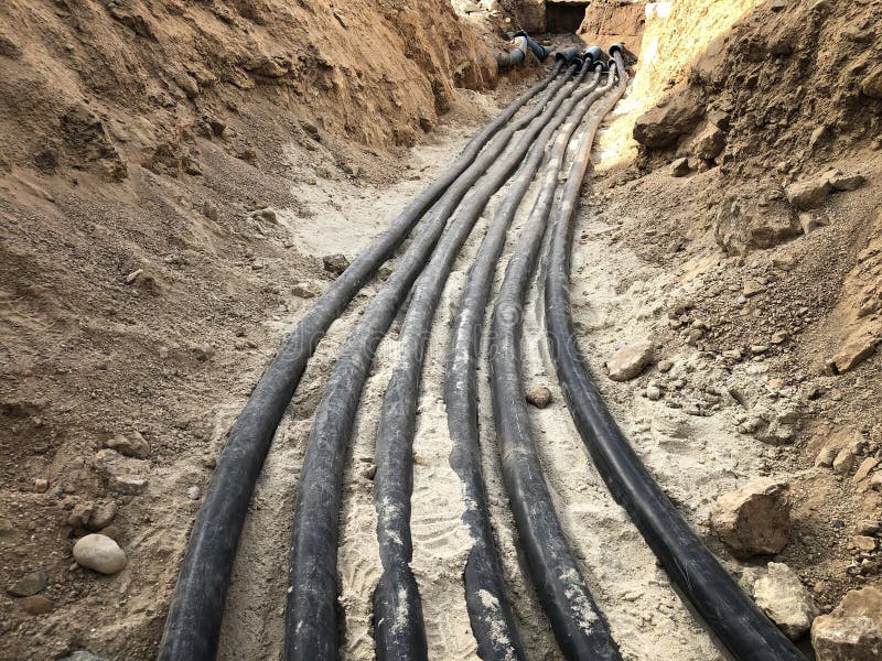 The High Voltage Electrical Cable is Laid in a Trench Stock Photo ...
