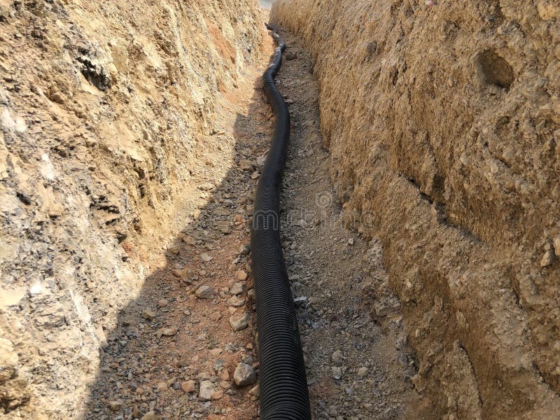 The High Voltage Electrical Cable is Laid in a Trench Stock Photo ...
