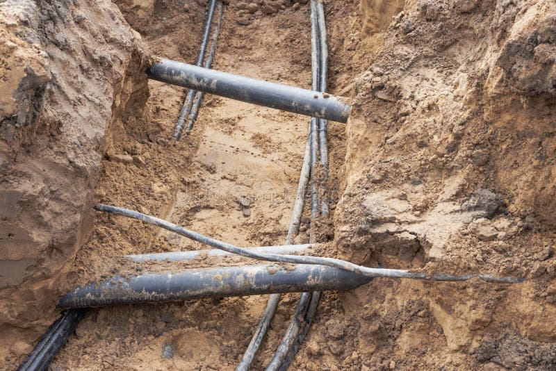 The High Voltage Electrical Cable is Laid in a Trench Under Existing ...