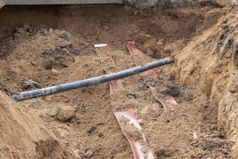 The High Voltage Electrical Cable is Laid in a Trench Under Existing ...