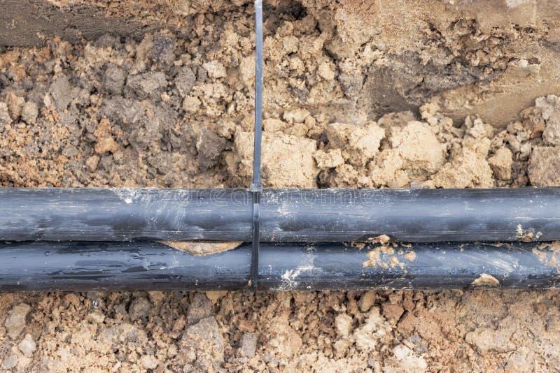 The High Voltage Electrical Cable is Laid in a Trench Under Existing ...