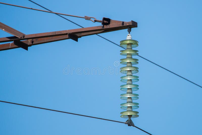 High-voltage Electrical Insulator Electric Line Against The Blue Sky ...