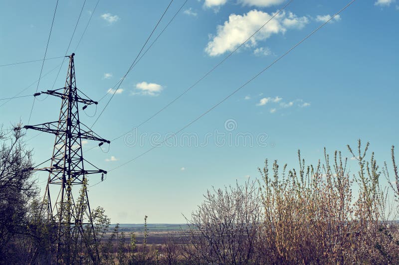 High Voltage Electrical Transmission Towers and Power Lines on Field ...
