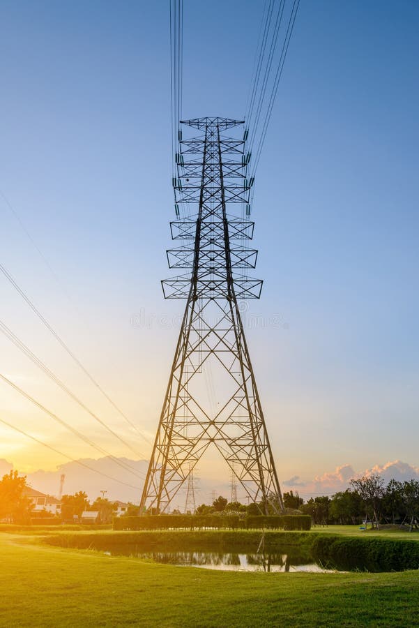 High Voltage Electricity Pylon System at Sunset Stock Photo - Image of ...