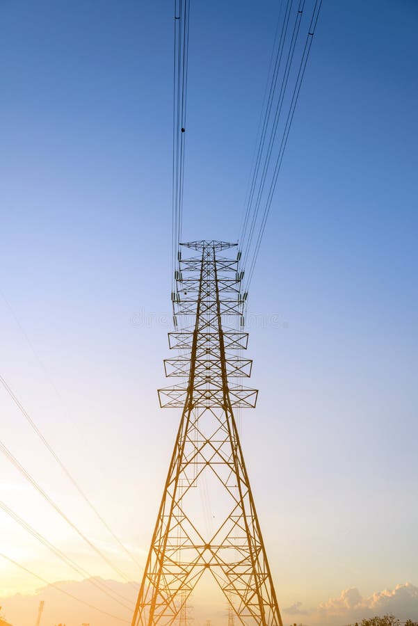 High Voltage Electricity Pylon System at Sunset Stock Image - Image of ...