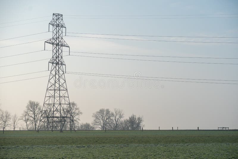 High Voltage Electricity Transmission Lines in Green Fields Stock Photo ...