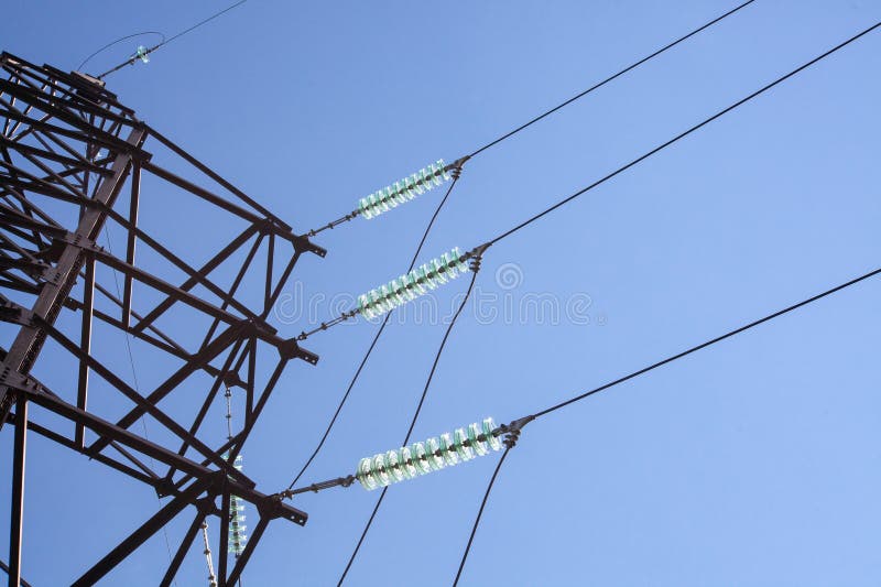 High Voltage Glass Electrical Insulator Electric Line Against the Blue ...