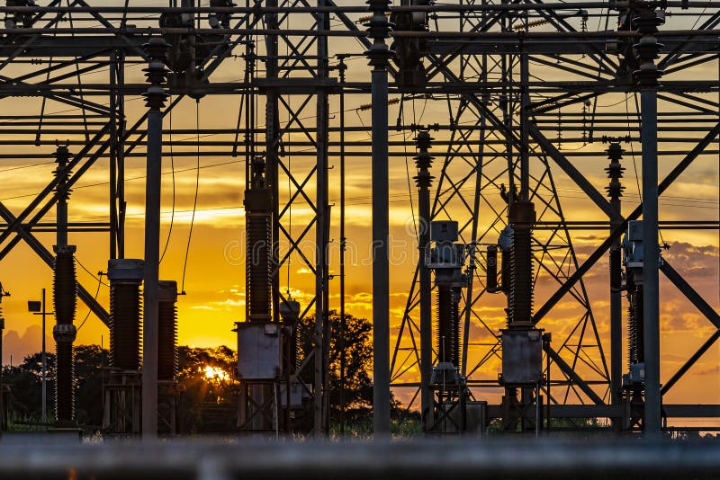 High-voltage Lines of Electrical Distribution Stations at Sunset ...