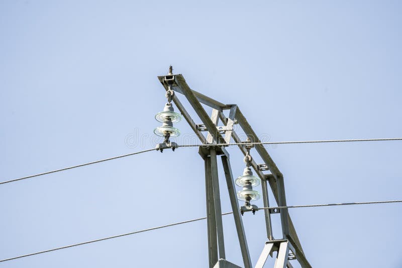 High Voltage Metal Tower with Glass Insulators Supporting the Cables ...