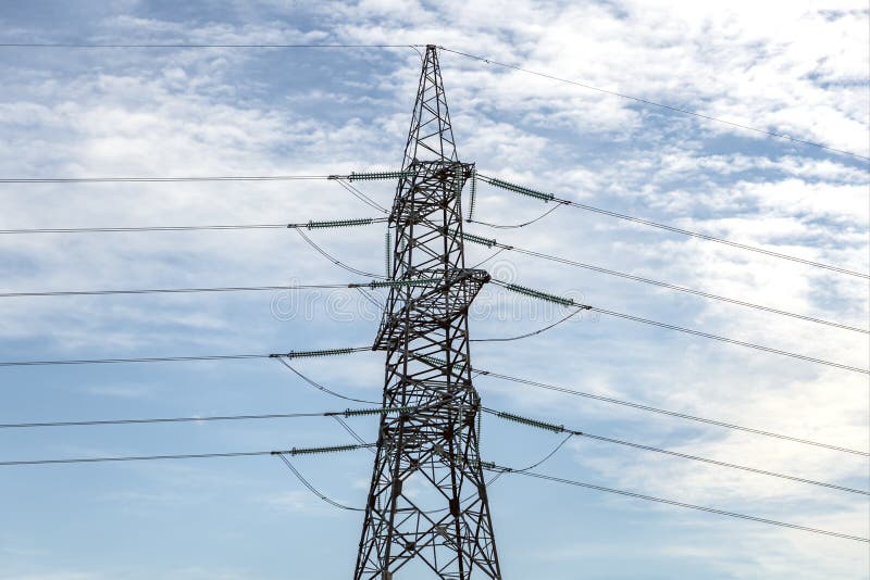 High Voltage Pillar. Power Grid Pole Against the Sky. High Voltage ...