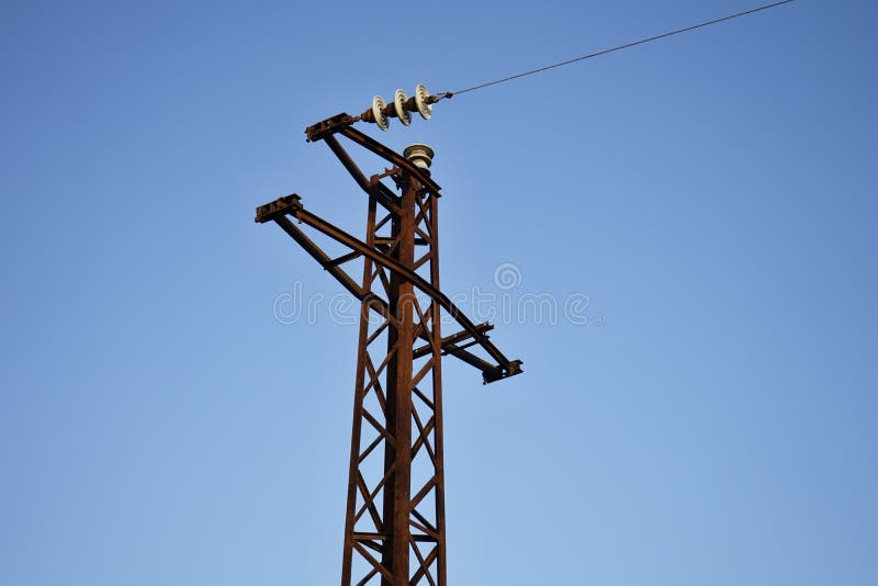 High Voltage Pole with Cable Stretched in Closeup View Stock Photo ...