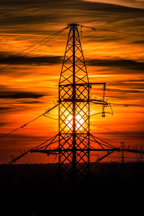 High Voltage Pole Power Line In The Background Of The Sunset Stock ...