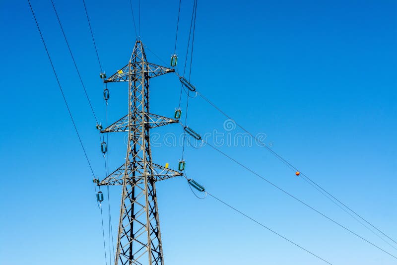 High Voltage Post on a Blue Background Stock Photo - Image of ...