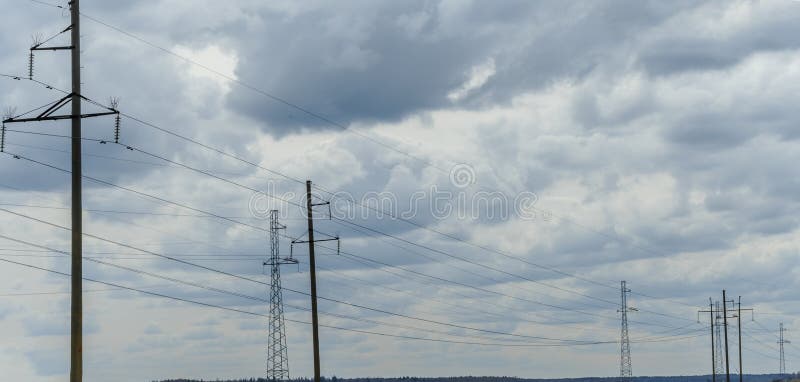 High Voltage Post on Blue Sky with Clouds Background. Electrical Net of ...